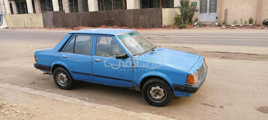 323 Mazda 1982 Masr Al Jadidah Blue 7147898 - Car For Sale : Hatla2ee